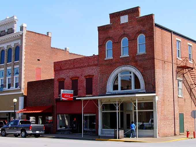 Classic brick storefronts line these peaceful streets where the biggest rush hour involves maybe three cars and a friendly wave.