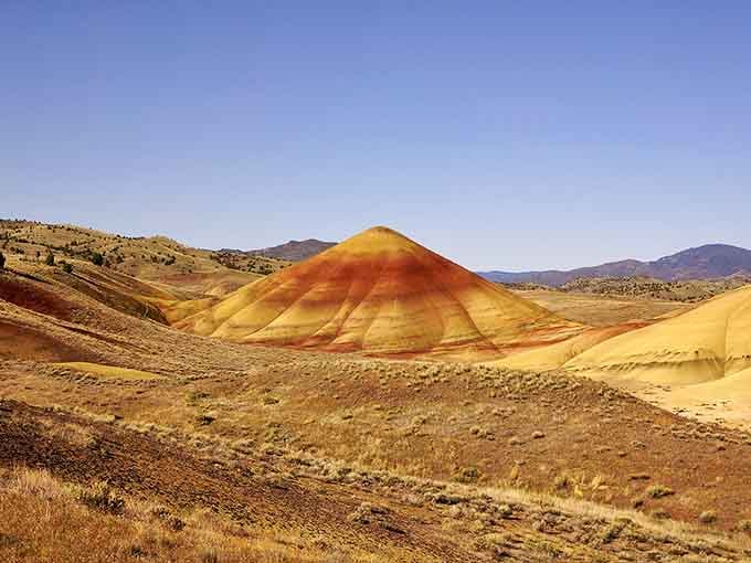Nature's layer cake rises from the desert floor in brilliant reds, golds, and oranges that defy belief.