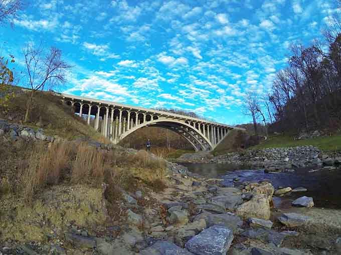 That graceful concrete arch soaring over the rocky Patapsco River proves Maryland's parks have serious dramatic flair.