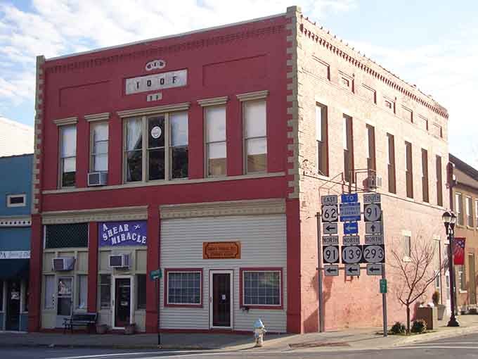 Red brick charm meets a classic salon! This historic spot looks like the perfect backdrop for an old-school movie scene.