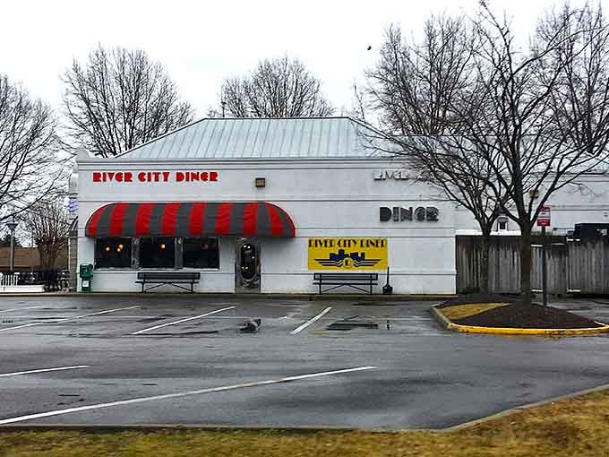 That bold red and white striped awning is basically a neon sign saying "happiness lives here."