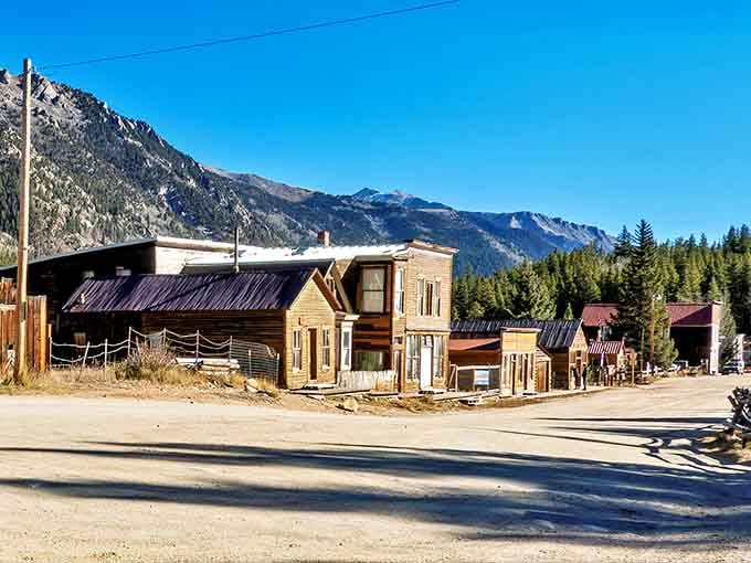 Saint Elmo's main street stands frozen in time, wooden storefronts leaning slightly under that impossibly blue Colorado sky.