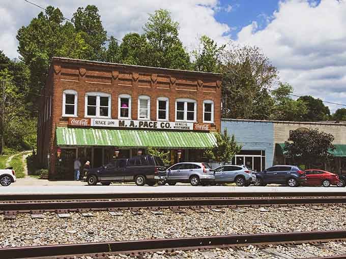 That green awning and vintage Coca-Cola sign tell you everything: this is small-town America at its finest.