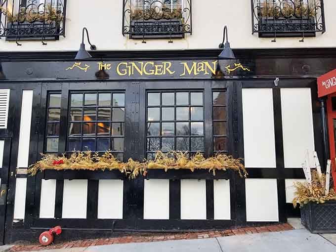 That Tudor-style facade with golden flower boxes looks like a fairy tale decided to serve chowder instead of gingerbread.
