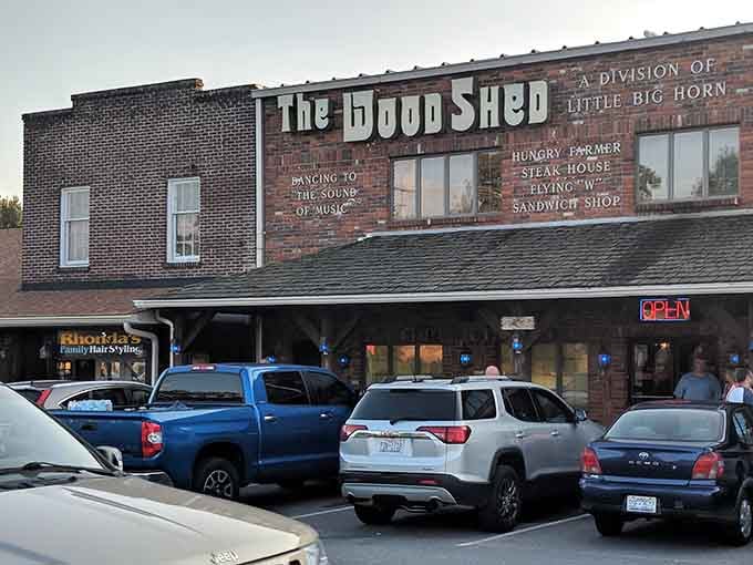 That packed parking lot at golden hour tells you everything you need to know about The WoodShed's reputation in Stanley.