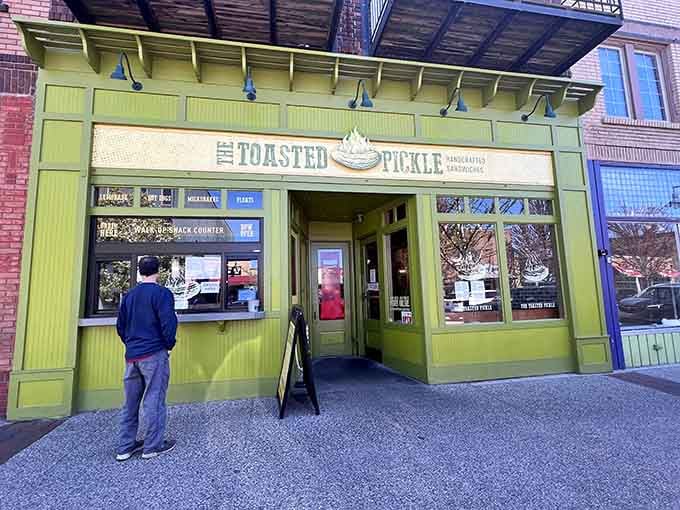 That cheerful pickle-green exterior isn't just inviting, it's practically demanding you come inside for lunch.