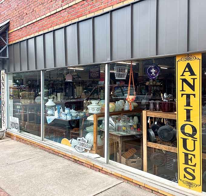 That bold yellow "ANTIQUES" sign isn't just decoration, it's a promise the store absolutely keeps.