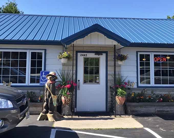 That blue metal roof and cheerful hanging baskets prove great food doesn't need flashy packaging to shine.