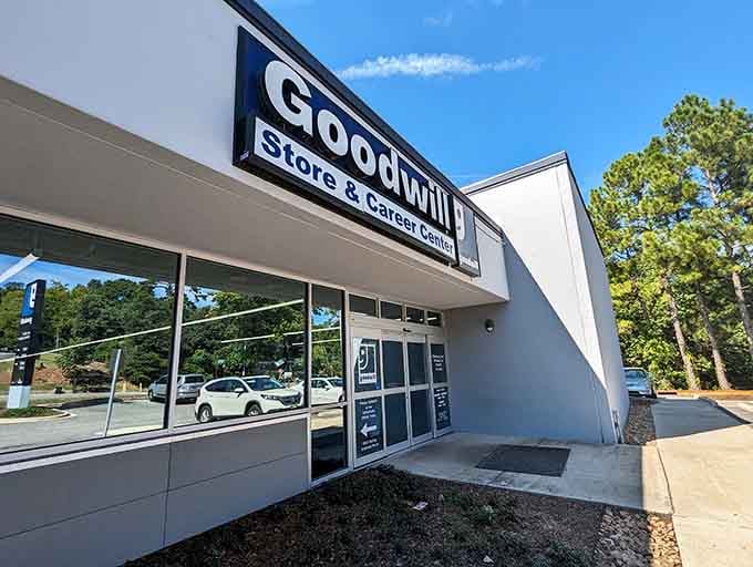 That bold blue-and-white Goodwill sign against a clear Alabama sky means serious bargain business is happening inside.
