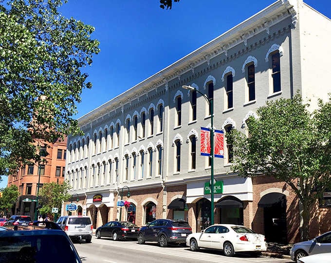 Traverse City's elegant historic storefronts stand tall under a brilliant blue sky, practically begging you to explore every charming doorway.