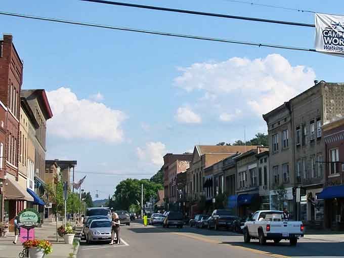 Classic brick storefronts line this peaceful street where the biggest traffic jam involves deciding which shop to visit first.