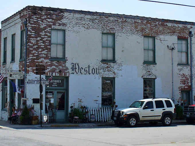 That weathered brick and painted signage tell stories older than your favorite vinyl records still do.