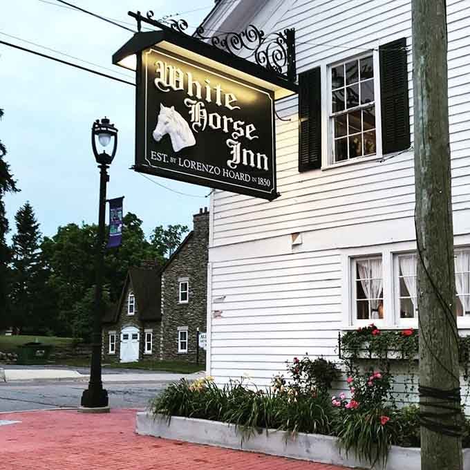 That glowing sign at dusk makes the White Horse Inn look like a storybook come beautifully to life.