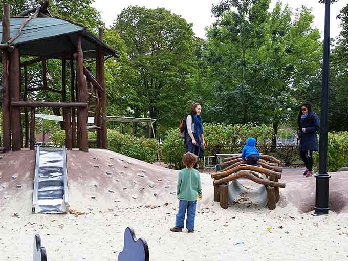 Wooden balance beams and sandy landing zones prove that simple designs often create the most memorable playground moments.