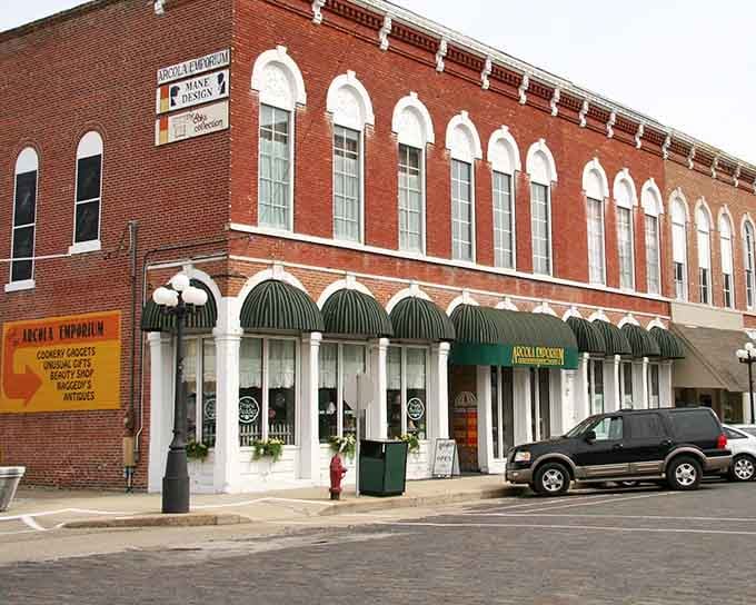 The Arcola Emporium's striped awnings and arched windows make this corner look almost too charming to be real.