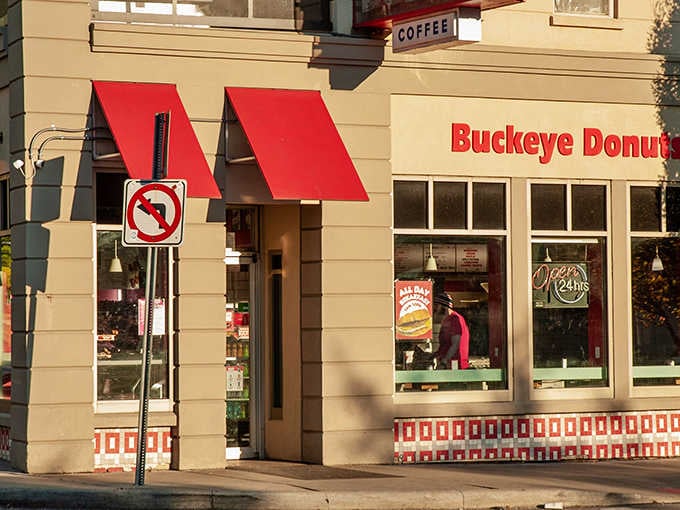 Golden hour sunlight hits those red awnings at Buckeye Donuts like a warm, sugary invitation you simply can't refuse.