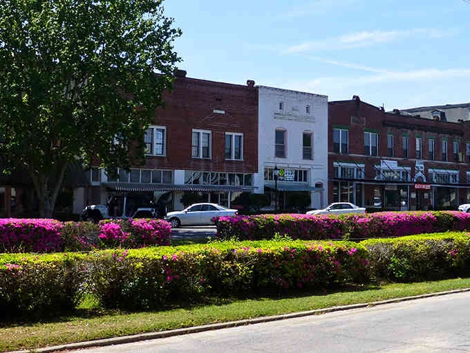 Those vibrant pink azaleas frame the historic buildings perfectly, creating a postcard-worthy view that changes with every season.