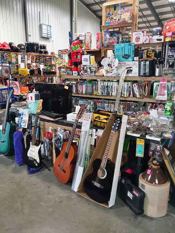 Guitars, gadgets, and a ceramic jug — this vendor booth is basically a greatest hits collection of American life.