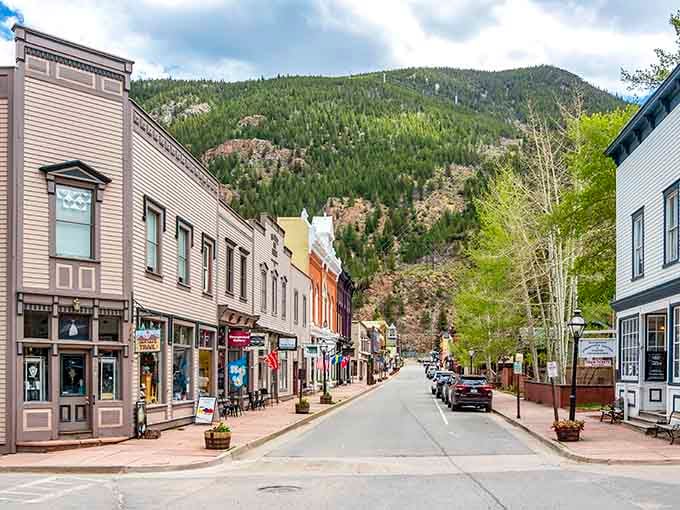 Those towering mountains cradle this historic street like nature's own picture frame, absolutely breathtaking every single time.