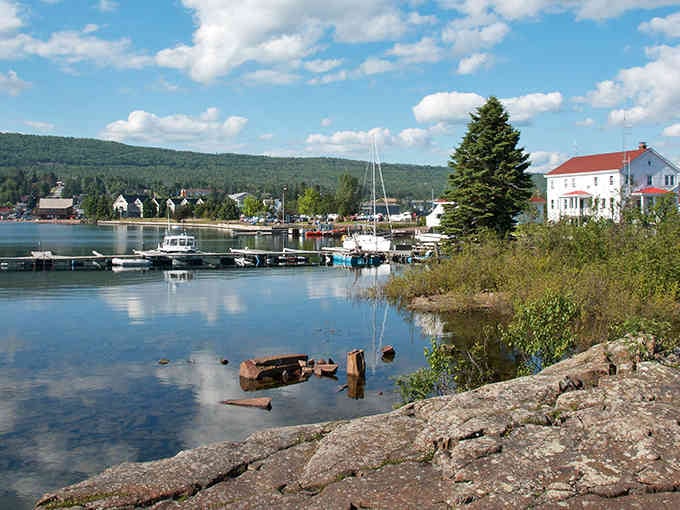 Harbor views framed by evergreens and historic buildings create a scene worthy of any artist's canvas today.