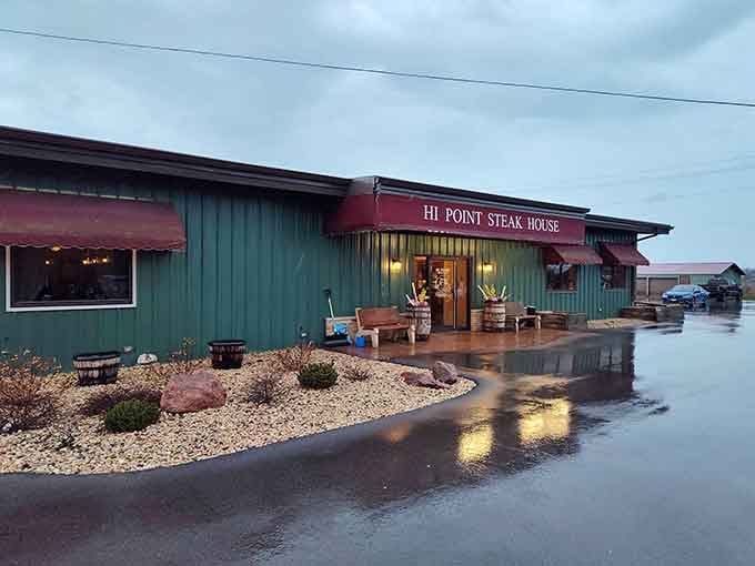 Even on a rainy evening, the warm glow spilling through Hi Point's entrance makes the parking lot feel like the best decision you've made all week.