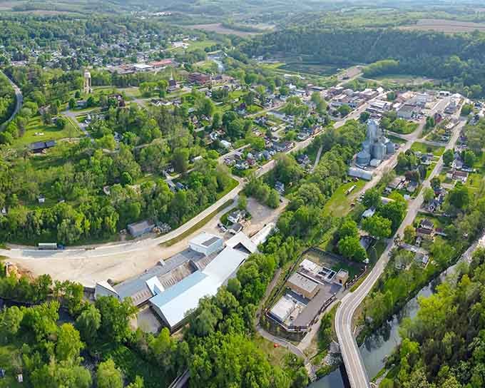 Tucked between rolling bluffs and a winding river, Lanesboro looks like someone built a town inside a landscape painting.