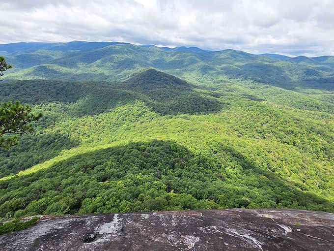 Clouds rolling in only make those endless layers of emerald ridgelines look more dramatic and alive.