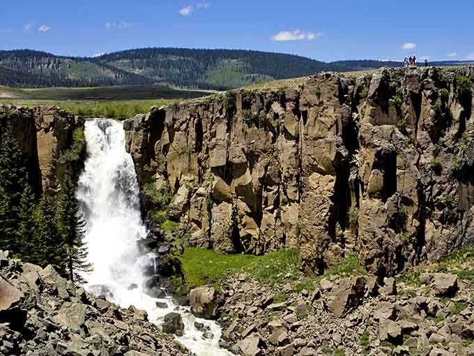 Tiny figures on the canyon rim remind you just how gloriously massive North Clear Creek Falls really is.