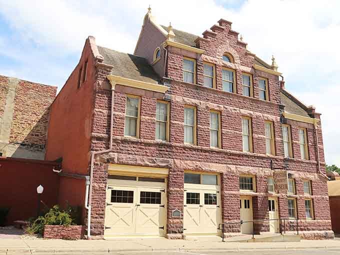 That pink quartzite building stands proud like a monument to craftsmanship from a bygone era.