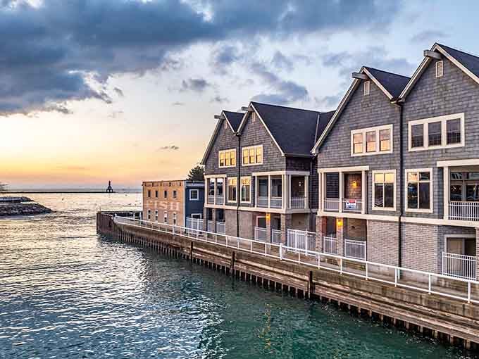 Warm lights glowing from harborside windows whisper a very convincing argument for staying just one more night.