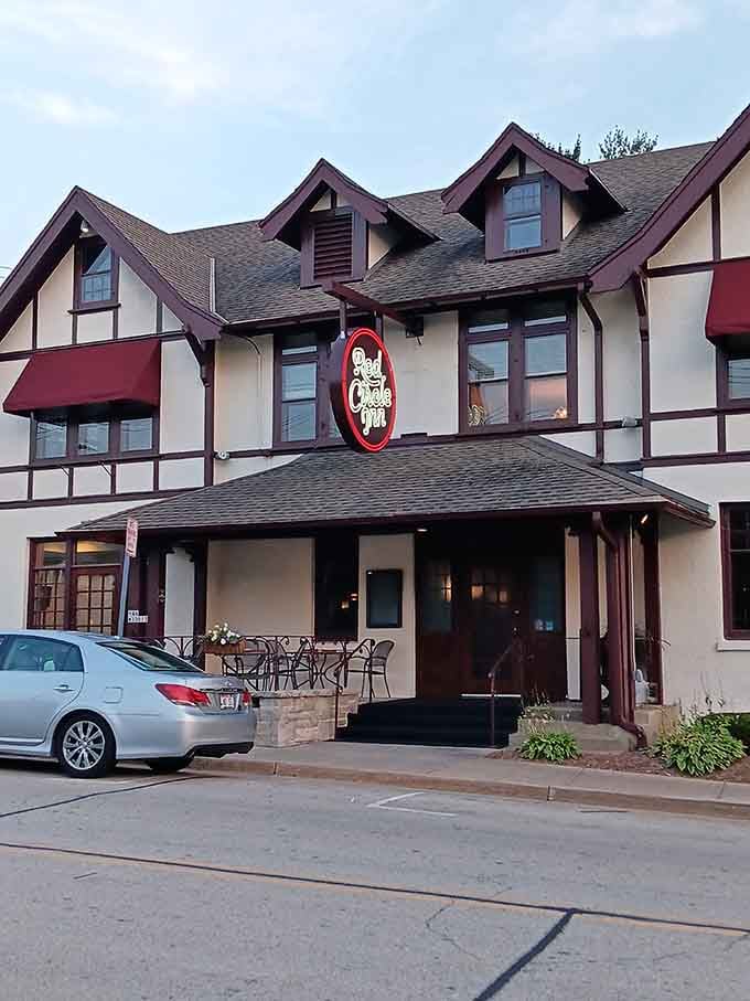 As dusk settles, the Red Circle Inn's glowing sign beckons like a warm invitation you simply can't refuse.