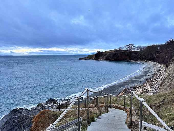Every step down that rope-railed staircase brings you closer to a shoreline that feels completely untouched and wonderfully remote.