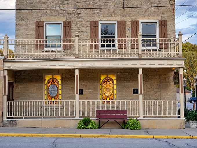 Limestone walls and vintage charm make this facade look like it wandered straight out of a Western movie set.