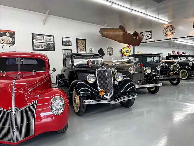 Classic cars rest under vintage signage, creating a scene straight from America's golden automotive age.