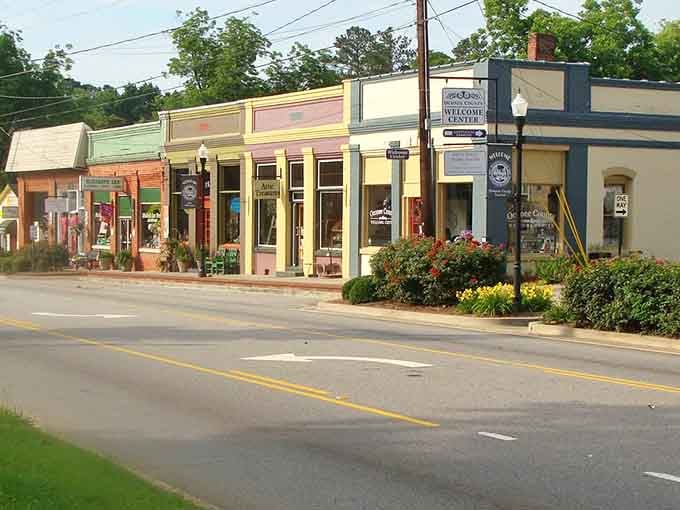 Pastel storefronts and blooming flower beds make Watkinsville's Welcome Center block look like a painting you can actually walk into.