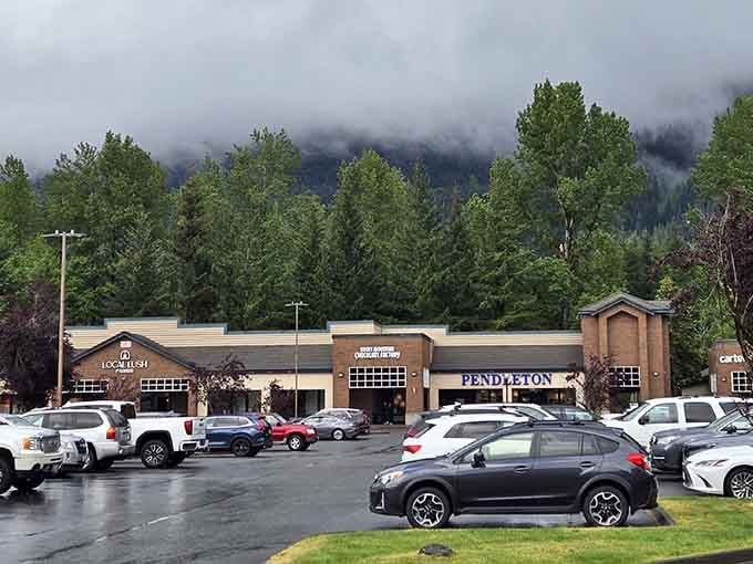 Misty mountains create the kind of dramatic backdrop that makes even parking lots look like postcard material.