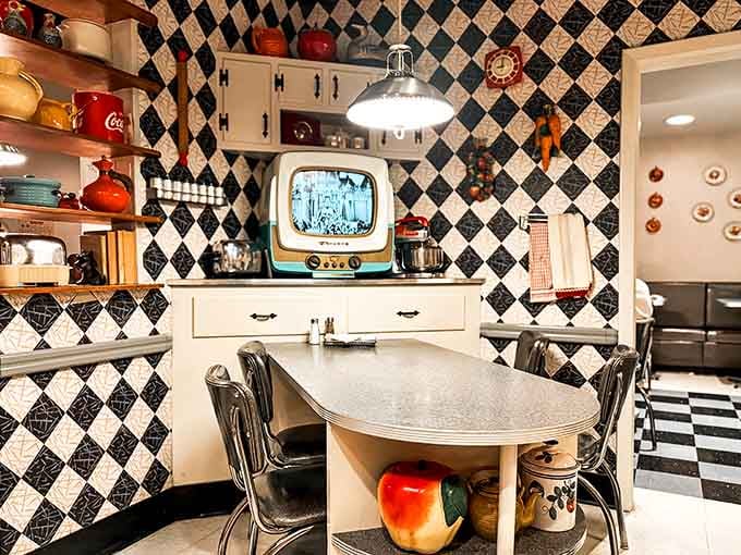 Black and white checkered floors, a vintage television playing classic shows. This kitchen hasn't aged a single day.