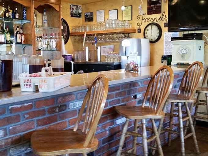 A brick bar, wooden stools, and a "Friends" sign on the wall. This place already knows what matters.