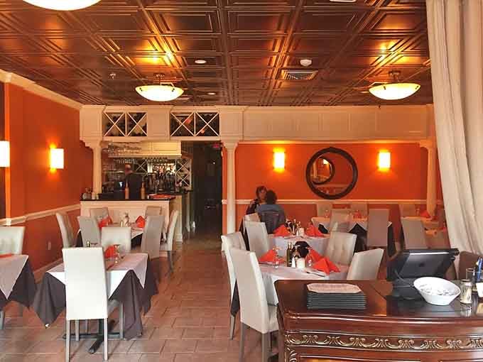 Warm orange walls, tin ceilings, and candlelit tables, this dining room means serious business about a good time.