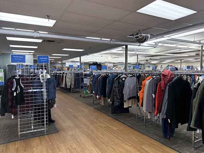 Row after row of organized clothing racks, proof that thrift shopping and chaos don't have to go together.