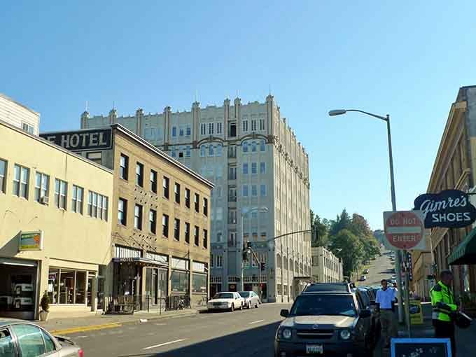 Downtown Astoria where historic buildings house modern dreams and parking spots actually exist for mere mortals.