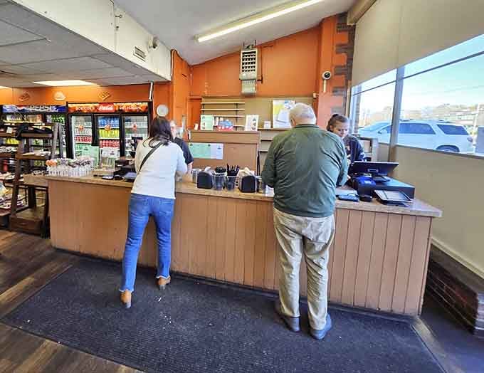 Friendly faces at the counter, proof that great food and genuine hospitality still go hand in hand at Augusta's.