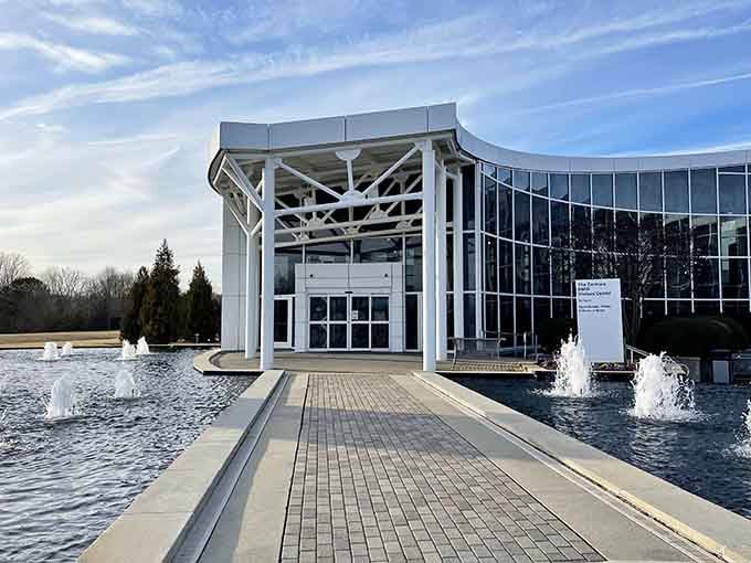 Modern architecture meets Southern hospitality in this stunning glass and steel masterpiece that welcomes automotive enthusiasts.