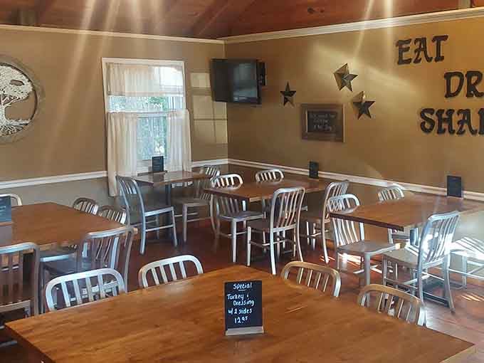Warm wood tables, metal chairs, and a wall that simply says "Eat, Drink, Share." Honestly, best life advice ever.
