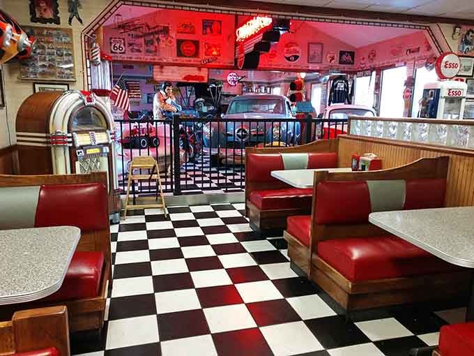 Black and white floors, red vinyl booths, and a Wurlitzer nearby &mdash; nostalgia never looked this comfortable.