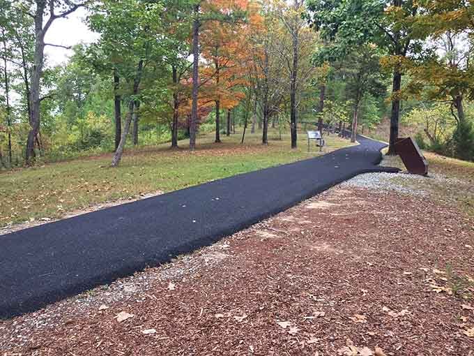 Fall colors frame the paved accessibility, proving that important history should welcome everyone who wants to experience it firsthand.