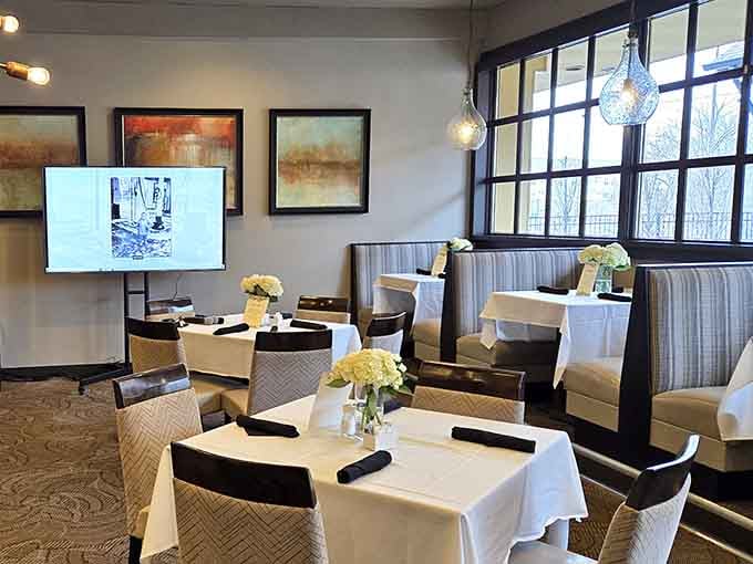 White linens, fresh flowers, and warm pendant lighting. This dining room means every visit feels like a special occasion.