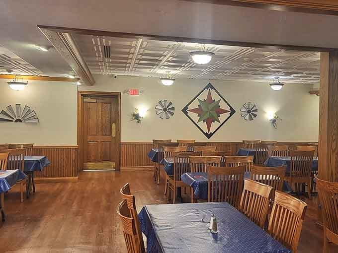 Pressed tin ceilings, barn quilt walls, and solid wood chairs, this dining room means serious, comfortable business.