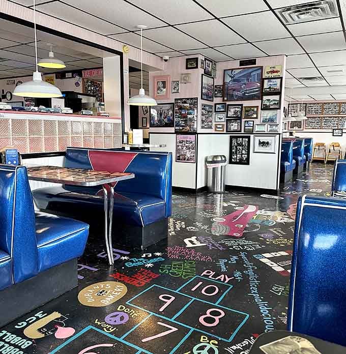Blue vinyl booths and a floor that doubles as nostalgic artwork make every meal feel like dinner theater.