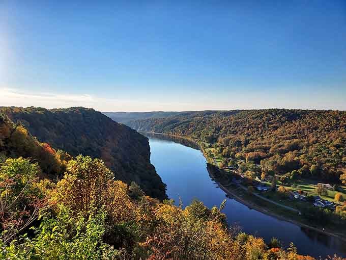 The Allegheny River bends here like it simply refused to leave, and honestly, who could blame it.